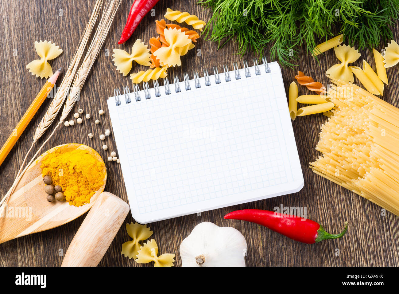 spices and vegetables around notebook Stock Photo - Alamy