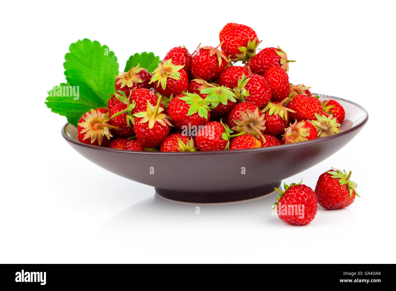 Strawberry in bowl isolated on white background Stock Photo - Alamy