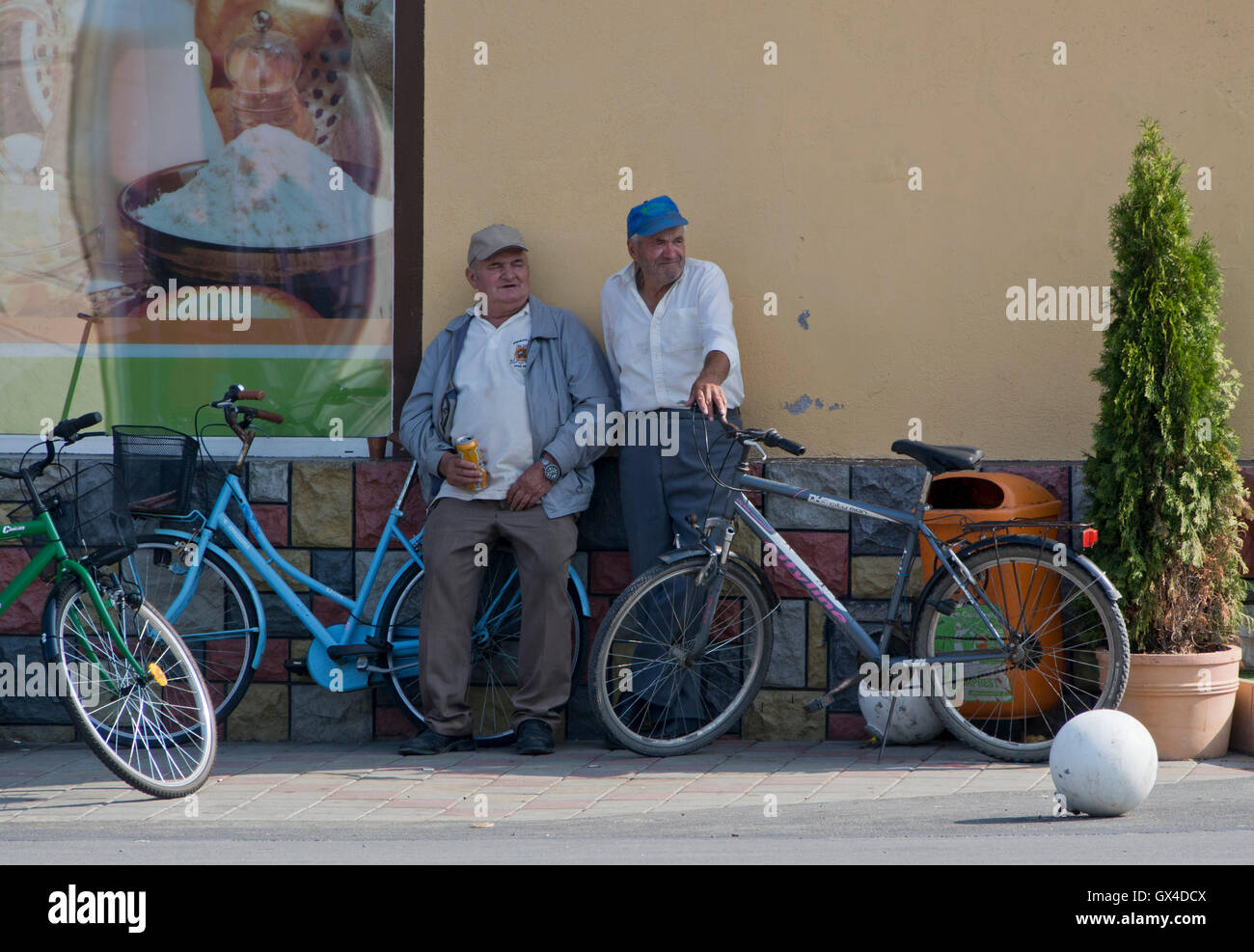 Senior men in the medieval city of Harman in Transylvania, Romania ...
