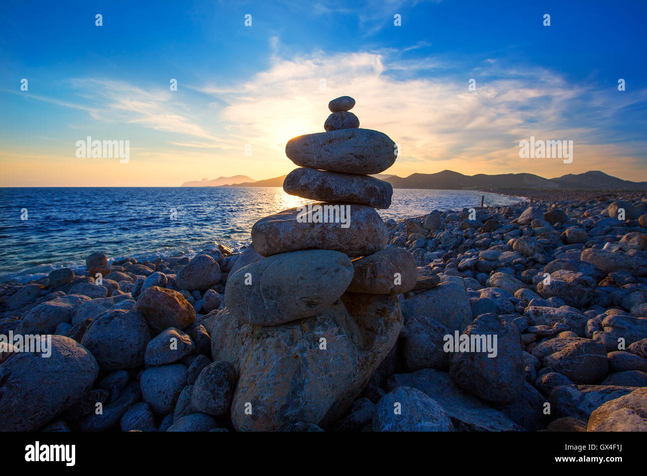 Ibiza Cap des Falco beach sunset with desire stones Stock Photo - Alamy
