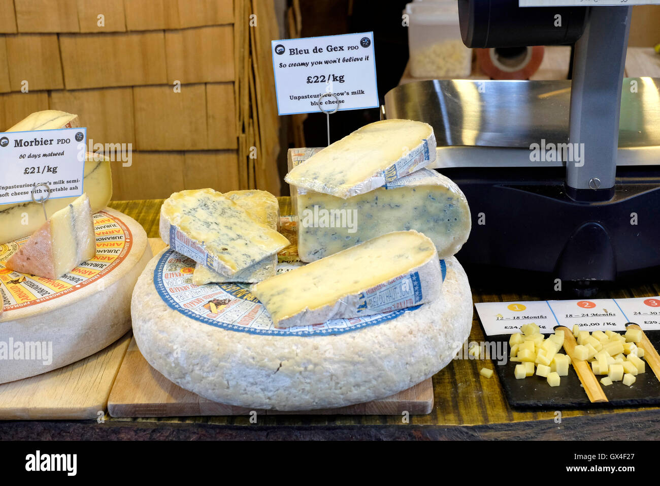 A close-up view of a cheese stall in Borough market Stock Photo - Alamy