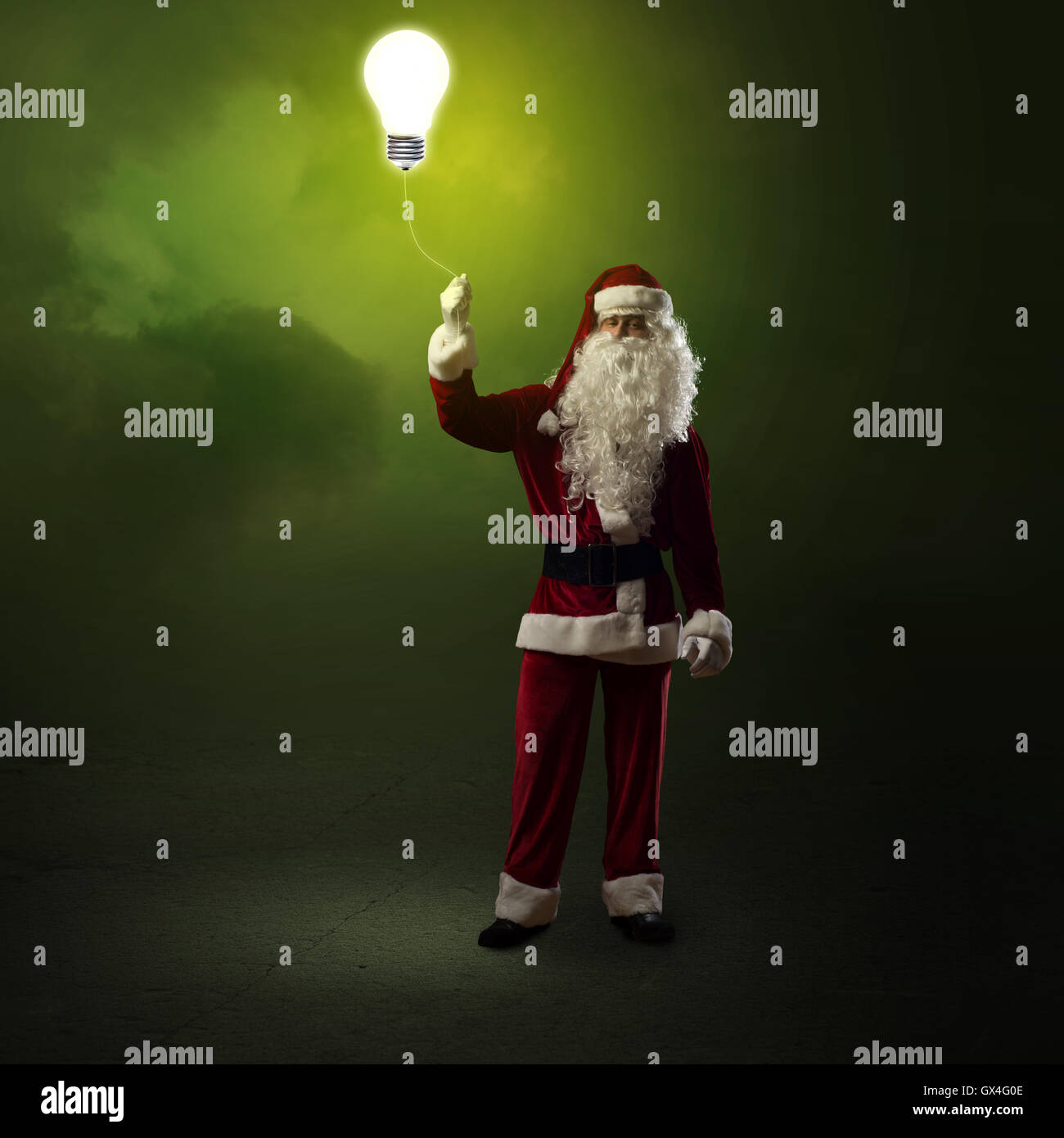 Santa claus holding shining lamp hi-res stock photography and images ...