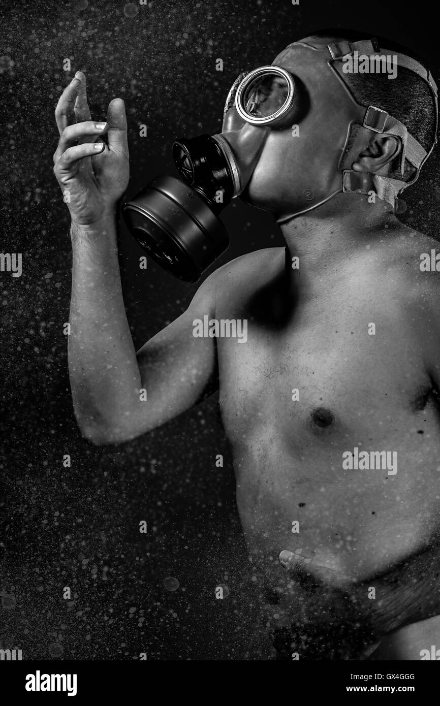 Destruction attack. A man in a gas mask in the smoke. artistic b Stock ...