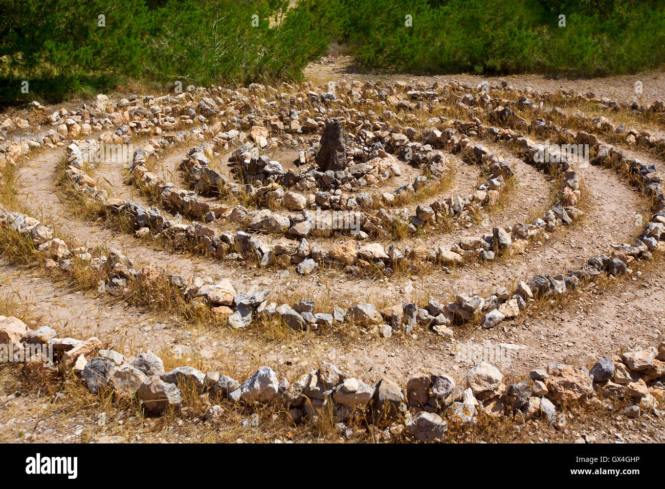 Atlantis spiral sign in Ibiza with stones on soil Stock Photo - Alamy