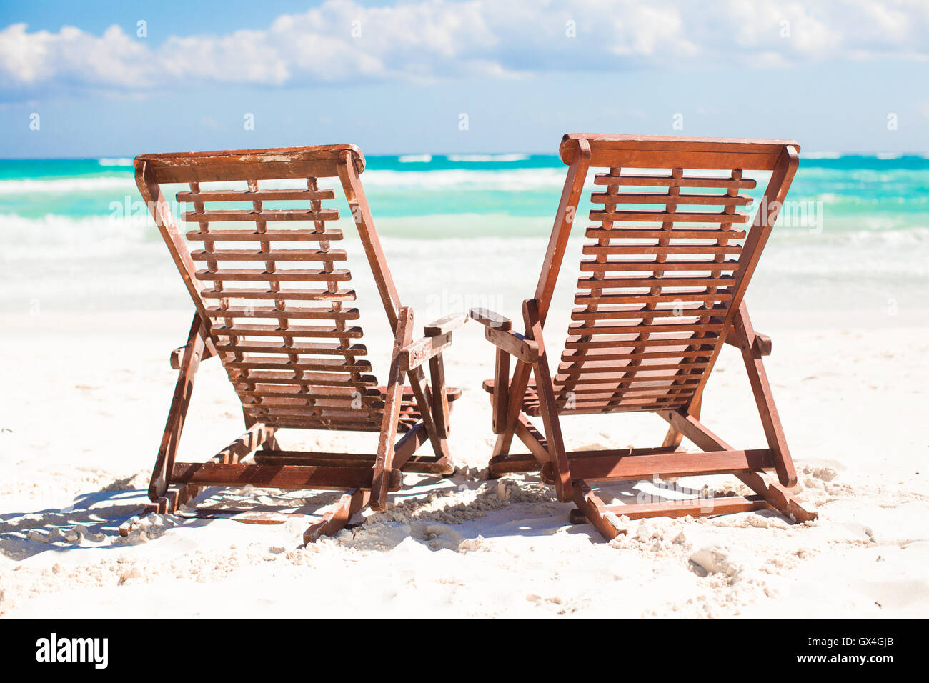 Beach wooden chairs for vacations and relax on tropical white sand ...