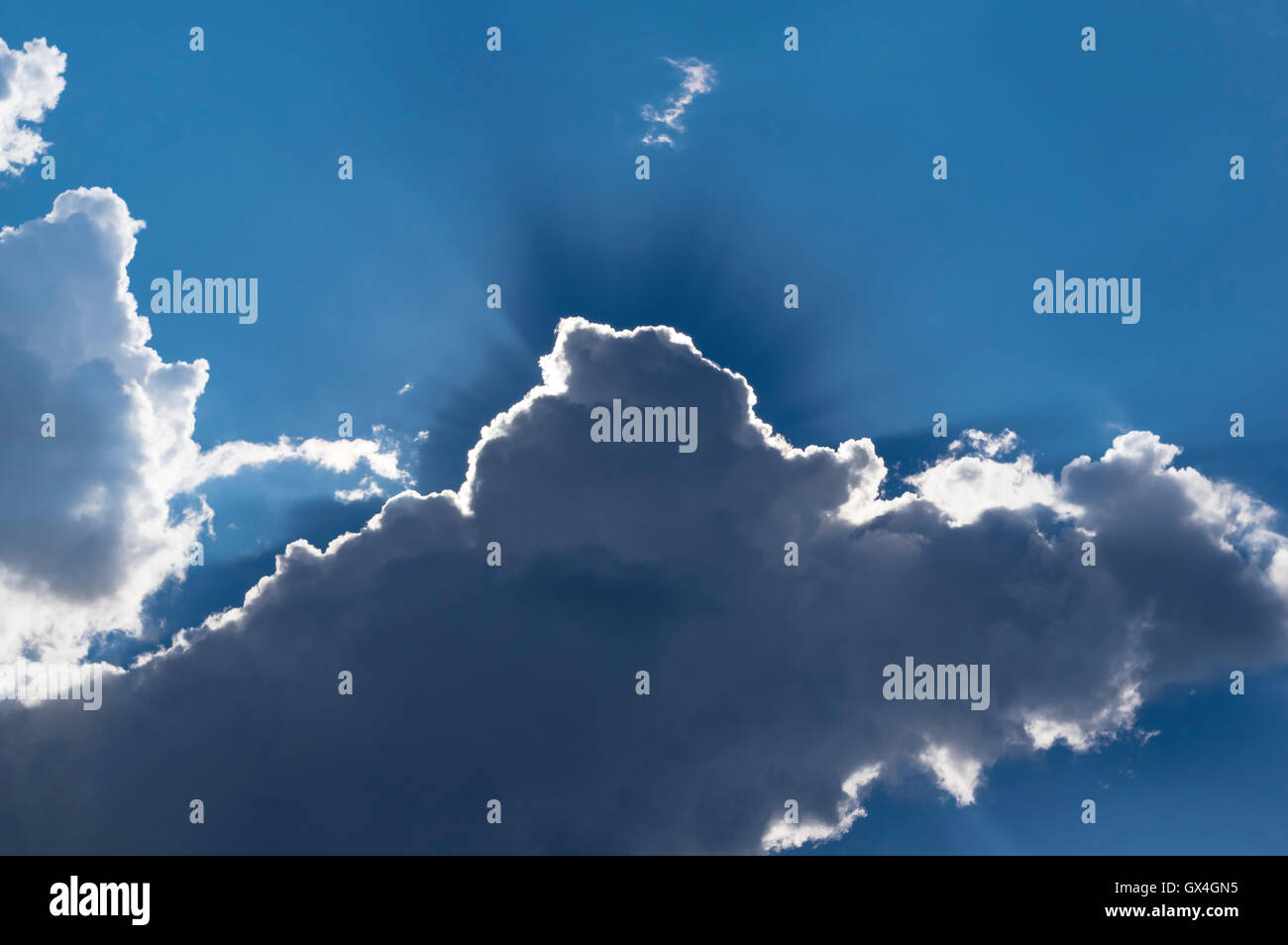 Cloud backlit by the sun, with sun rays clearly visible Stock Photo - Alamy