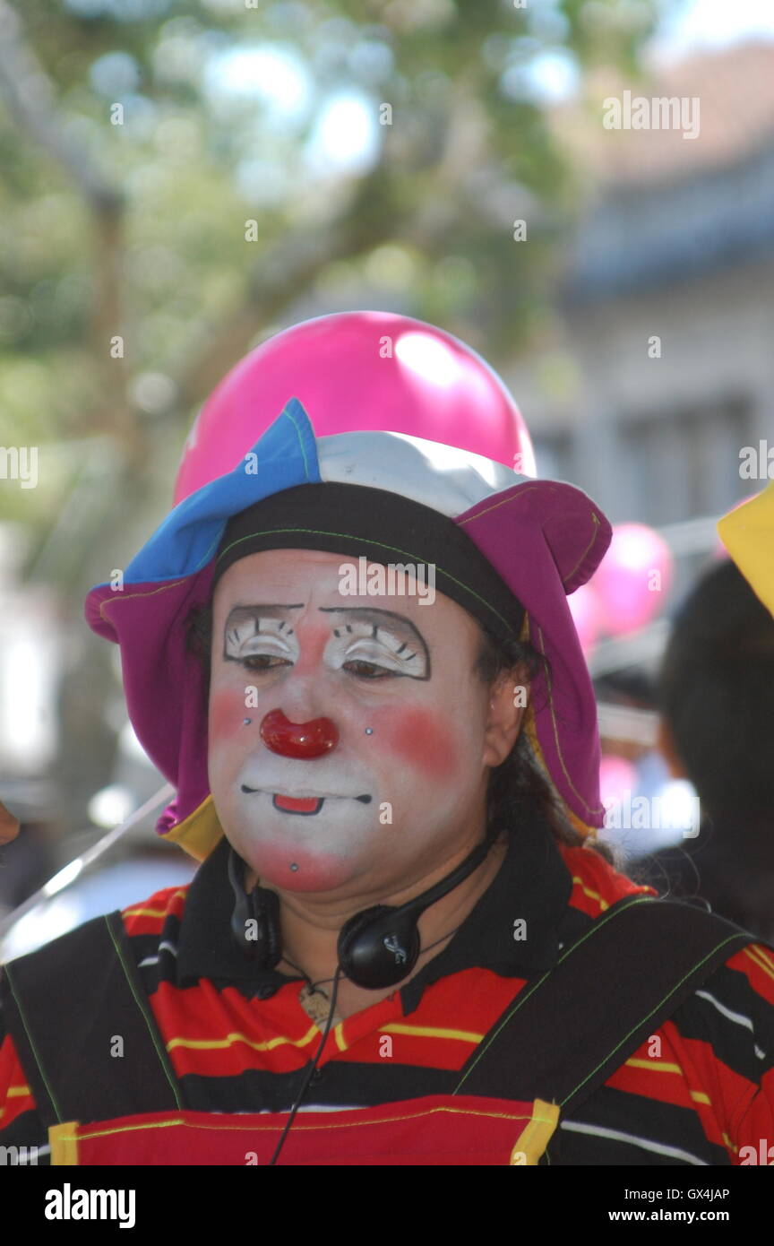 Thoughtful clown in a park Stock Photo - Alamy