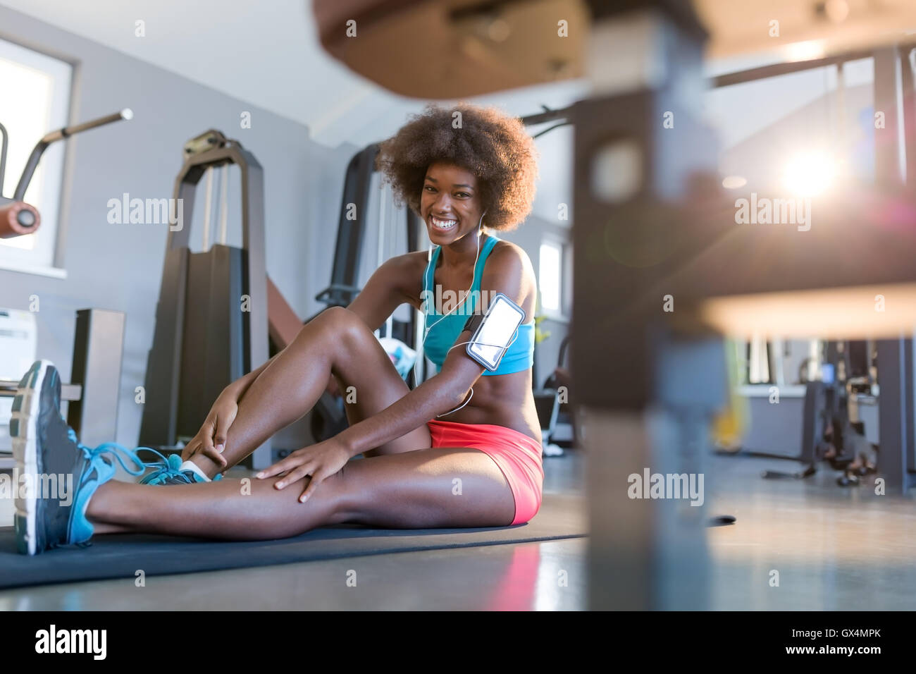 Girl resting after hard workout at the gym Stock Photo - Alamy