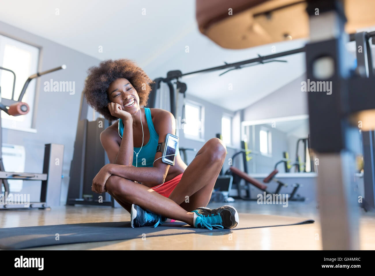 Girl resting after hard workout at the gym Stock Photo - Alamy