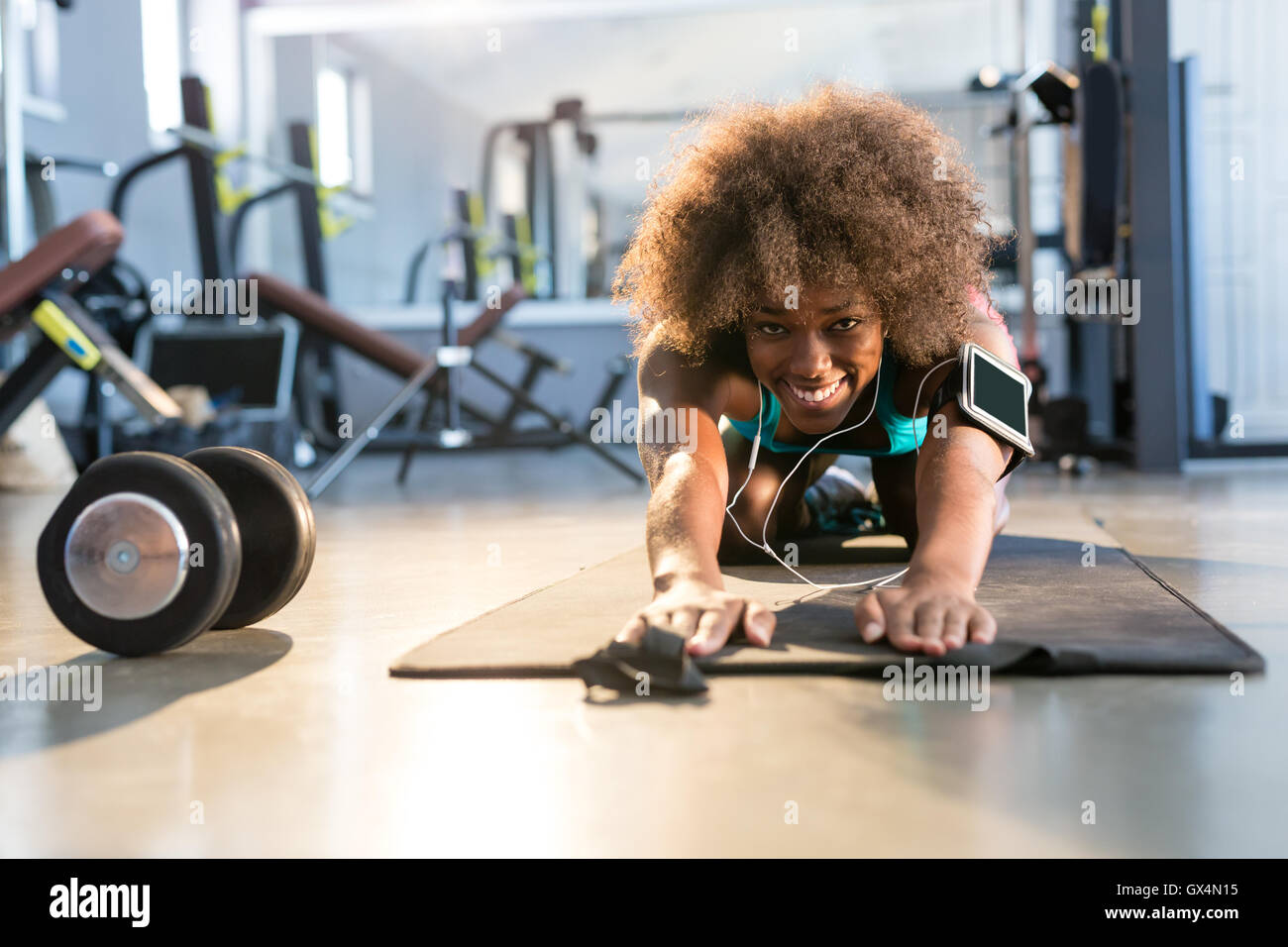 Muscular woman stretching in crossfit gym Stock Photo - Alamy