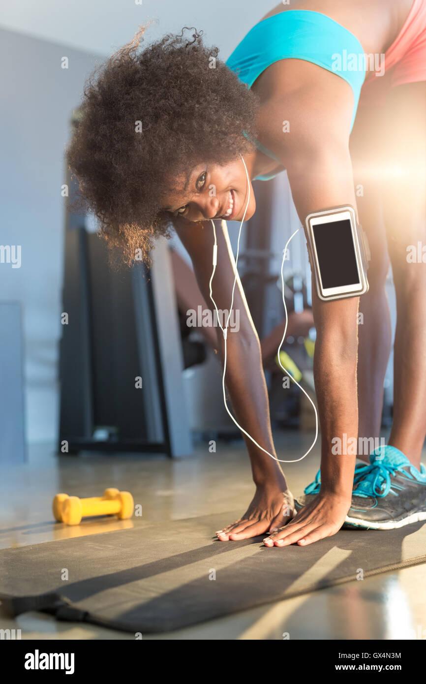 Muscular woman stretching in crossfit gym Stock Photo - Alamy