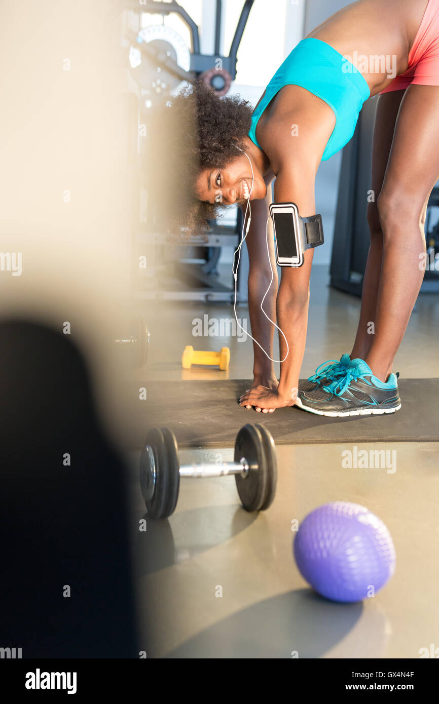 Muscular woman stretching in crossfit gym Stock Photo - Alamy