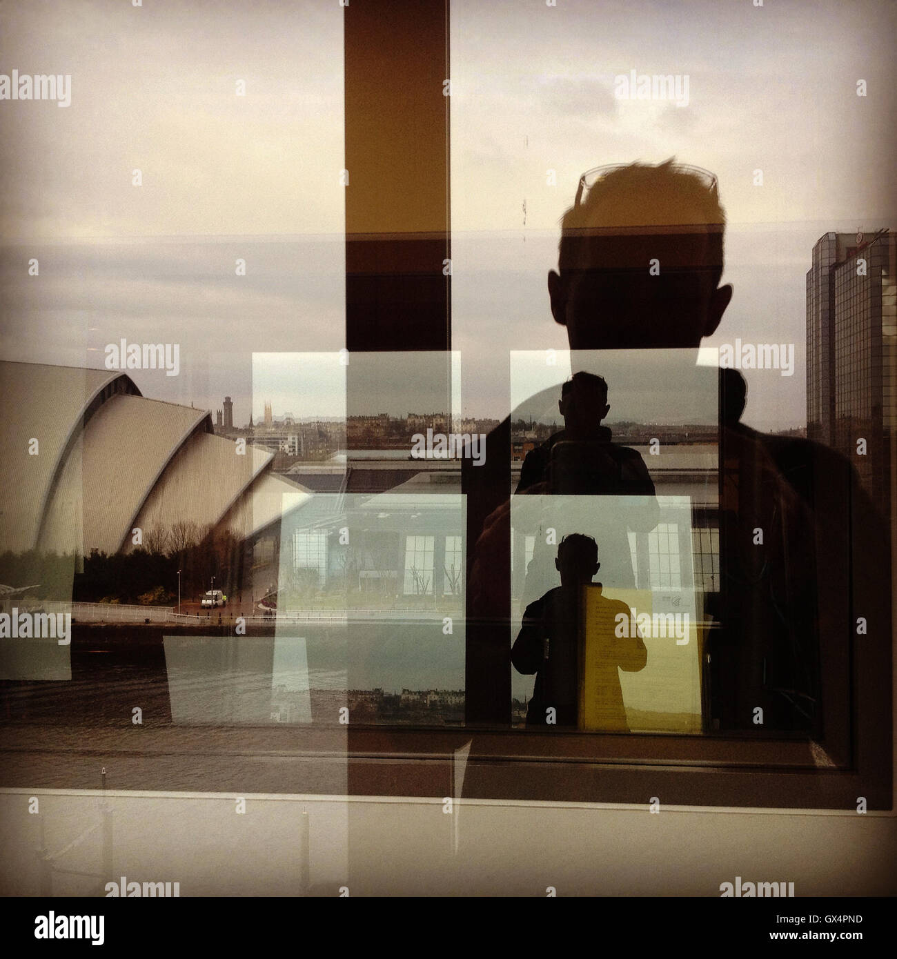 Reflection of male in window, in Glasgow, Scotland Stock Photo - Alamy