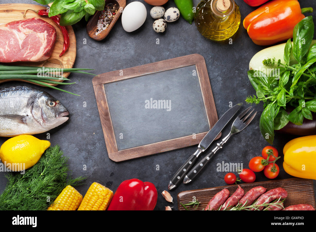 Vegetables, fish, meat and ingredients cooking. Tomatoes, eggplants ...