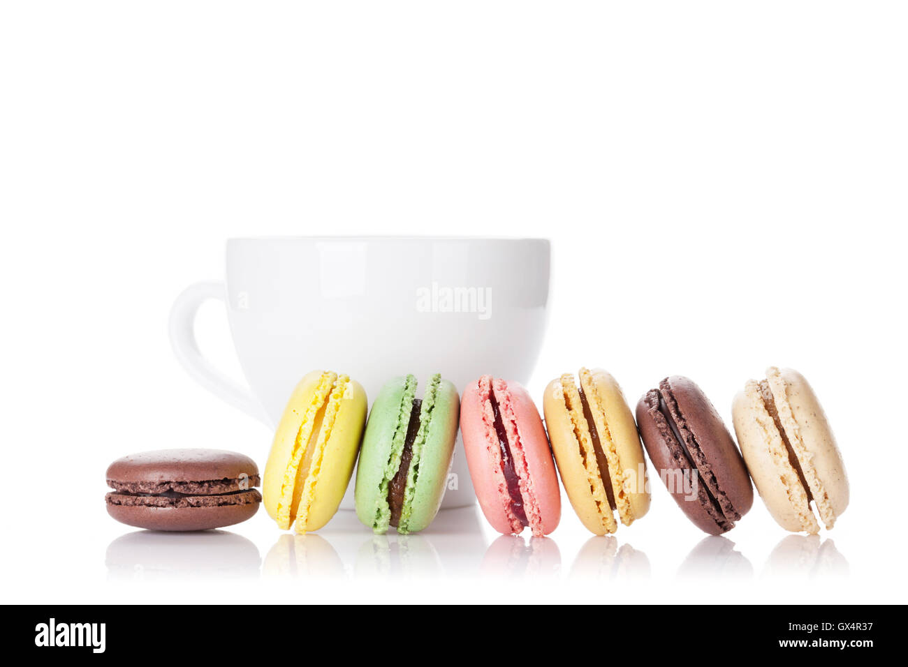 Colorful macaroons and cup of drink. Sweet macarons. Isolated on white ...