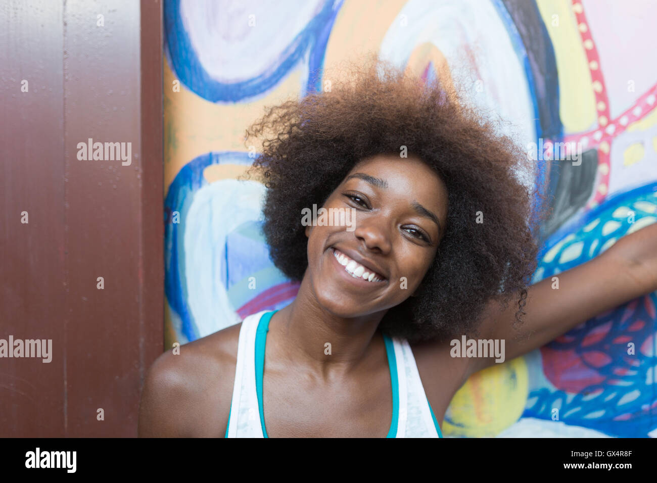 Portrait of a young black woman, model of fashion in urban background ...