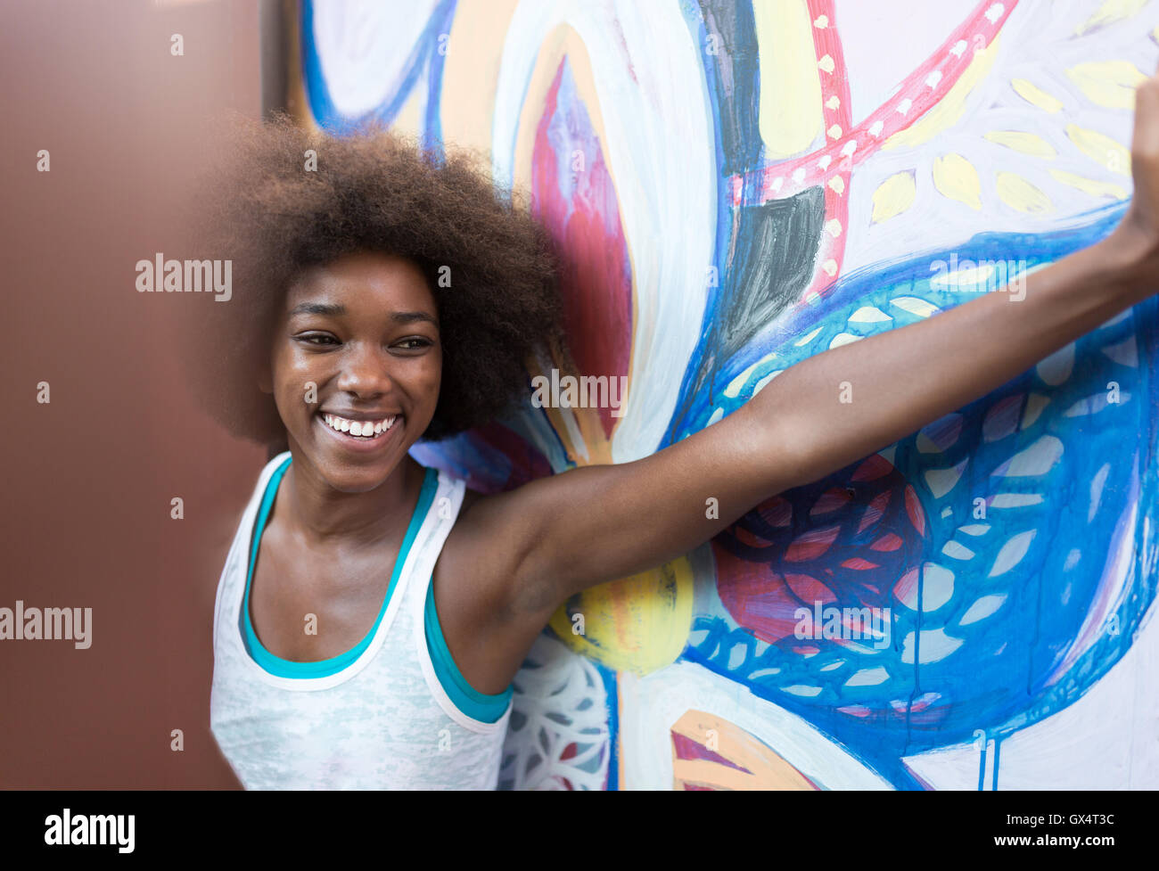Portrait of a young black woman, model of fashion in urban background ...