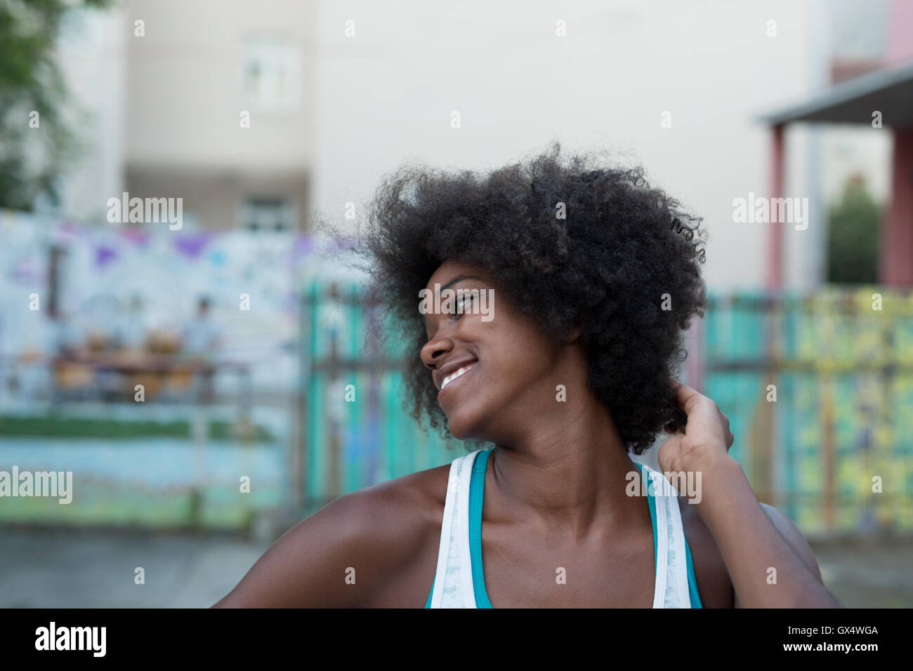 Portrait of a young black woman, model of fashion in urban background ...