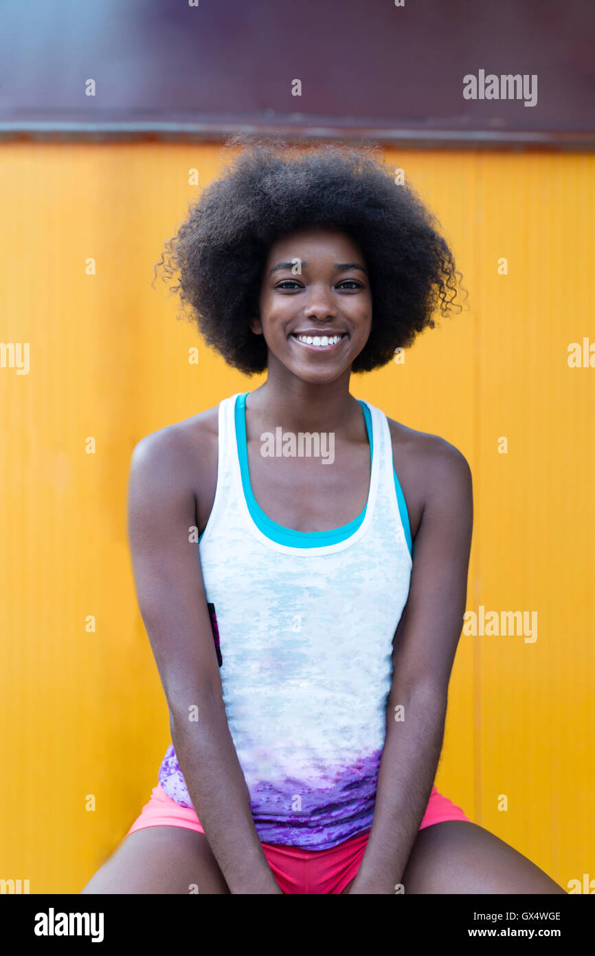 Portrait of a young black woman, model of fashion in urban background ...