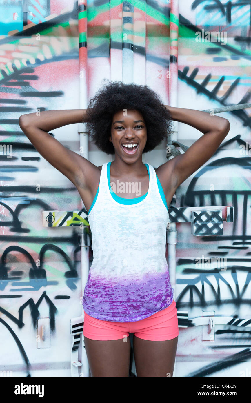 Portrait of a young black woman, model of fashion in urban background ...