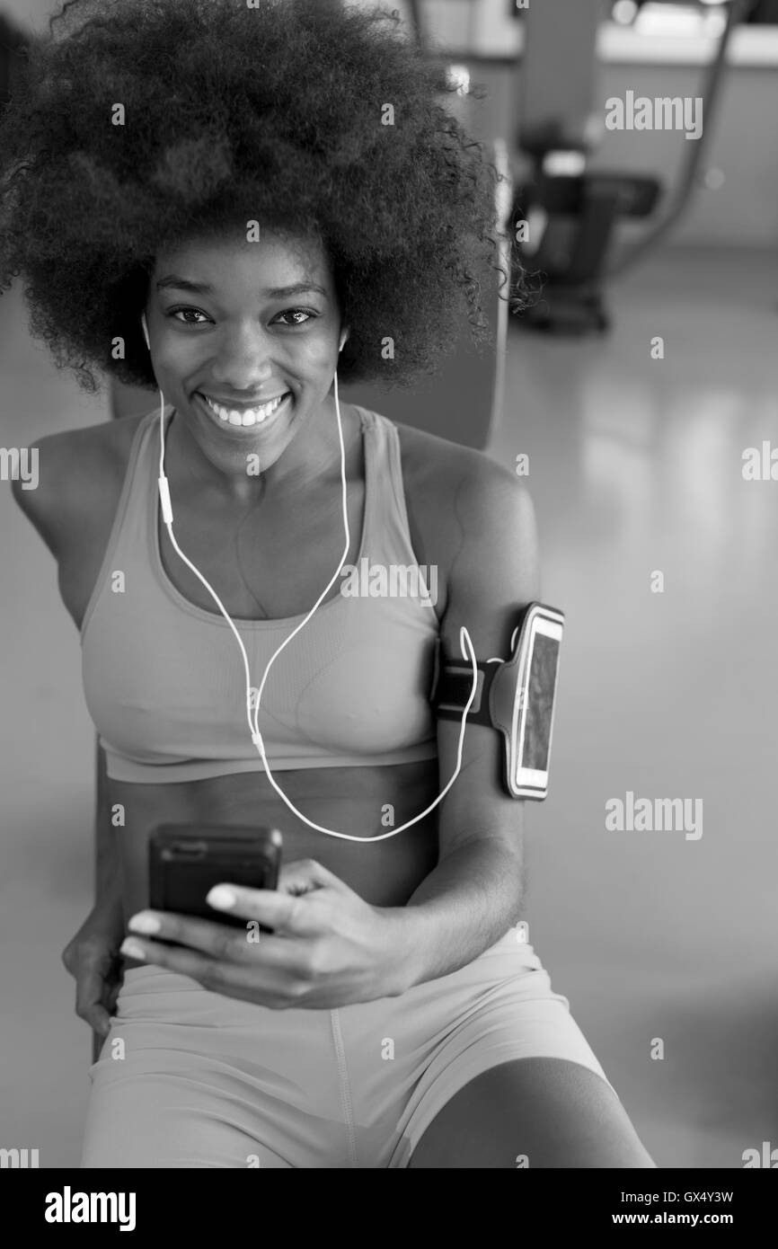 Girl resting after hard workout at the gym Stock Photo - Alamy