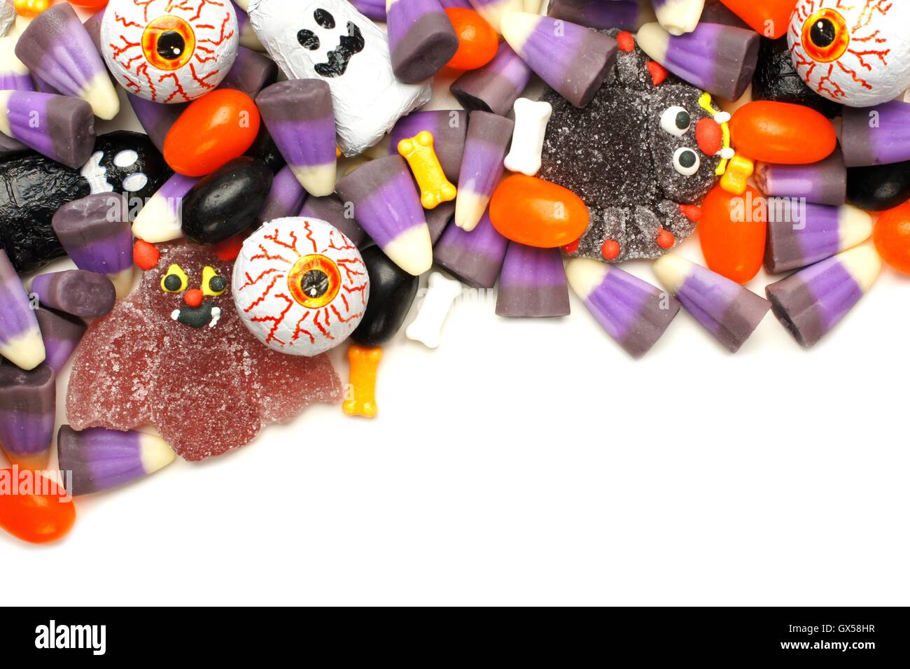 Halloween candy corner border over a white background Stock Photo - Alamy