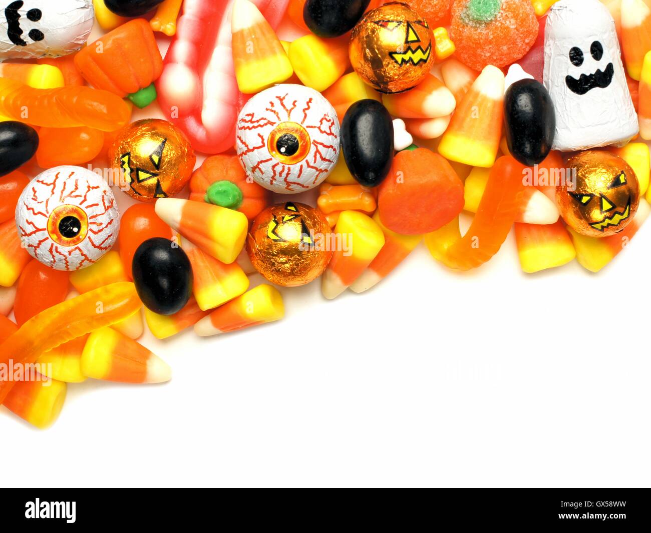 Halloween candy corner border over a white background Stock Photo - Alamy