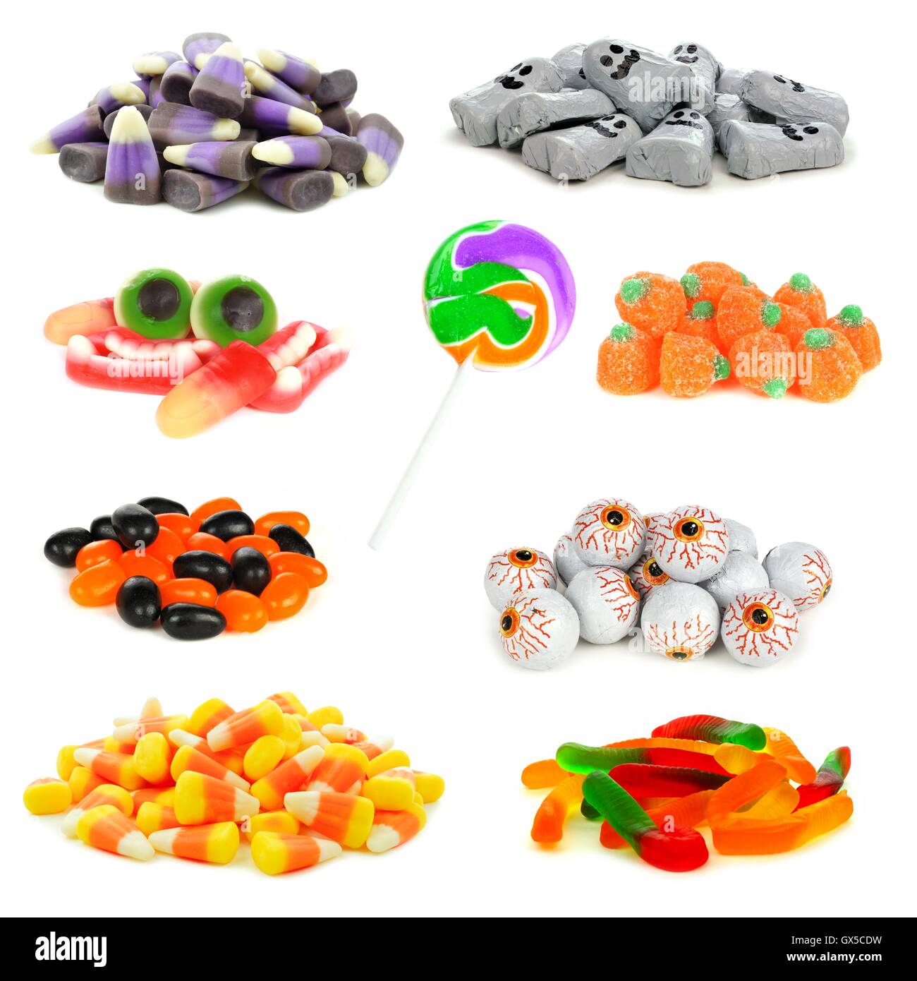 Assortment of Halloween candies in isolated clusters over a white ...