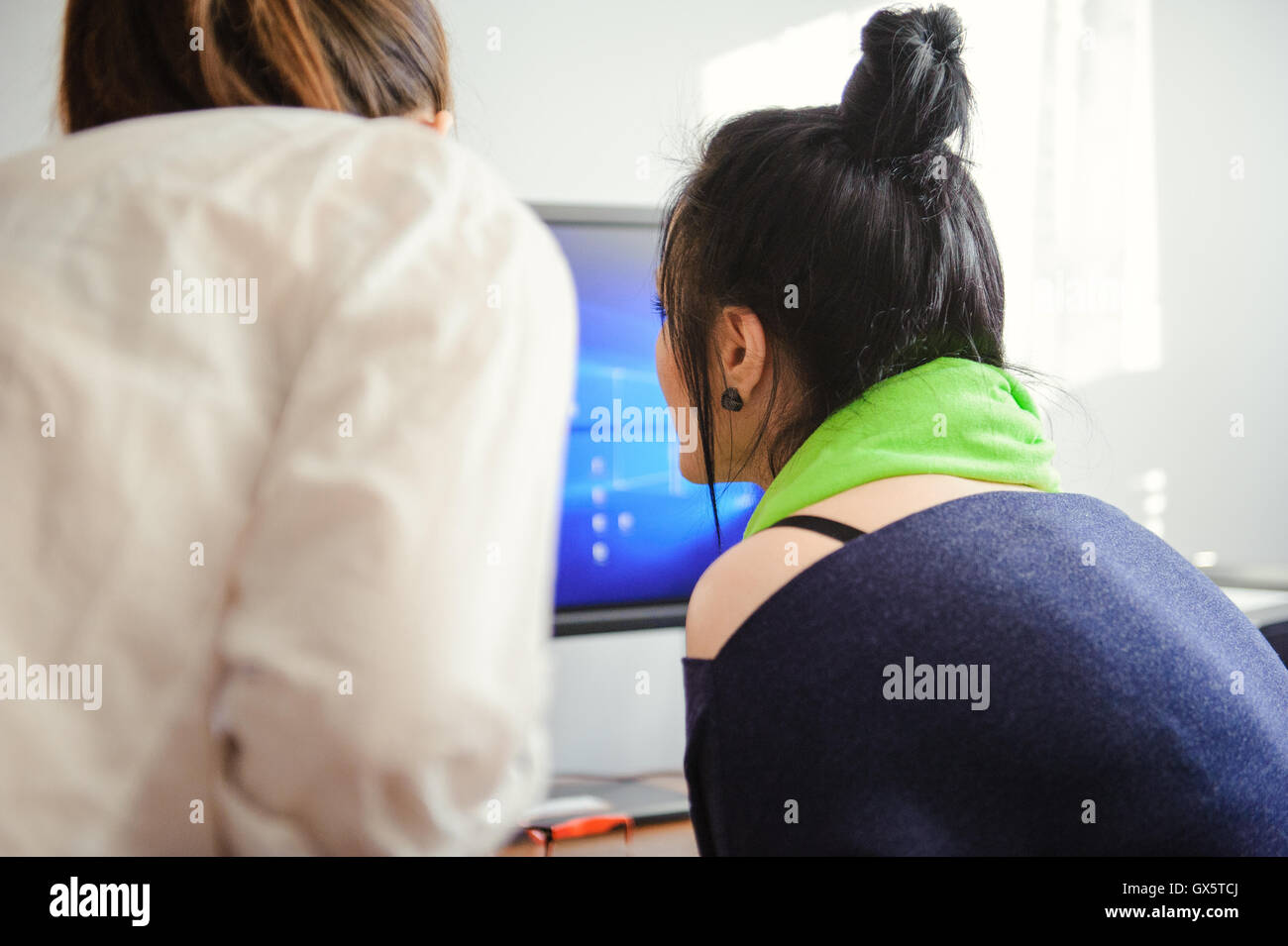 online shopping and technology concept - two girls with computer Stock ...