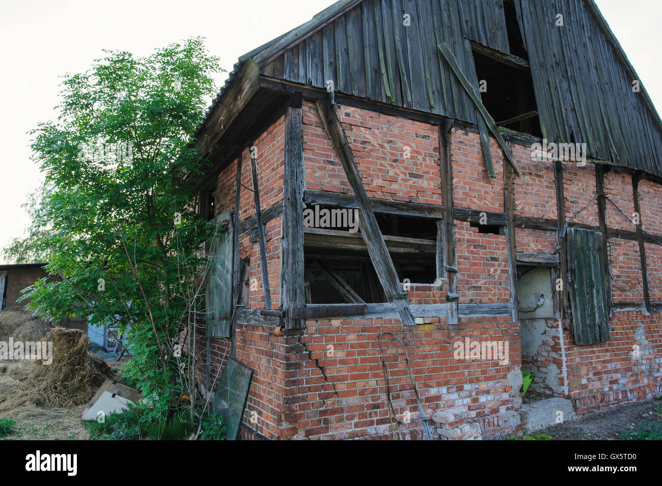 old red brick wall building destroyed after war Stock Photo - Alamy