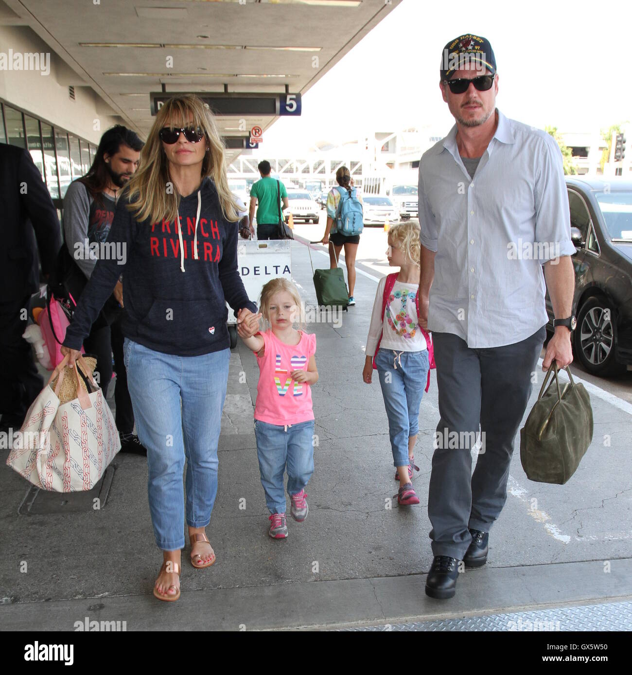 Eric Dane arrives at Los Angeles International Airport with his family ...