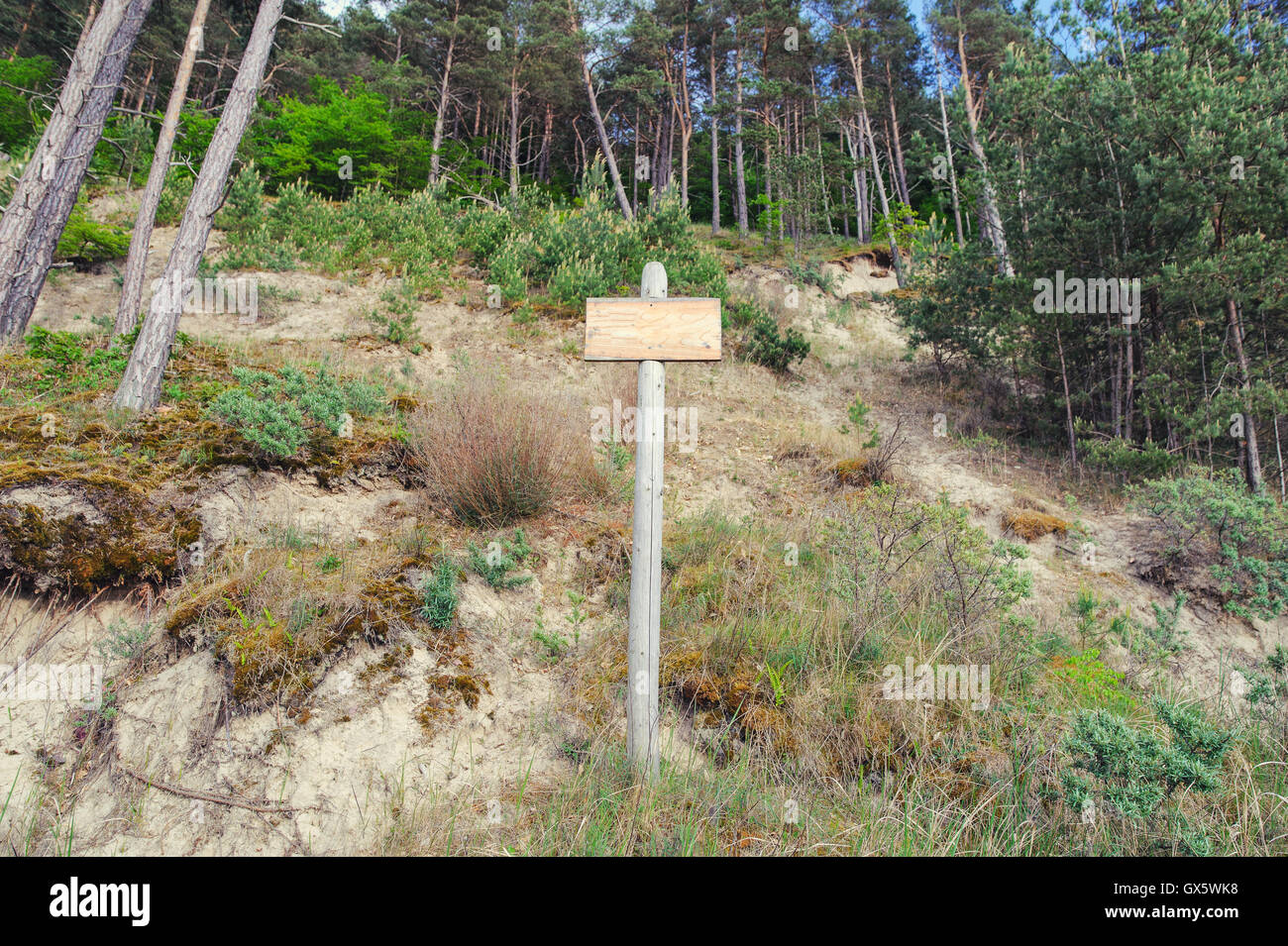 Wooden warning signboard on beach hi-res stock photography and images ...