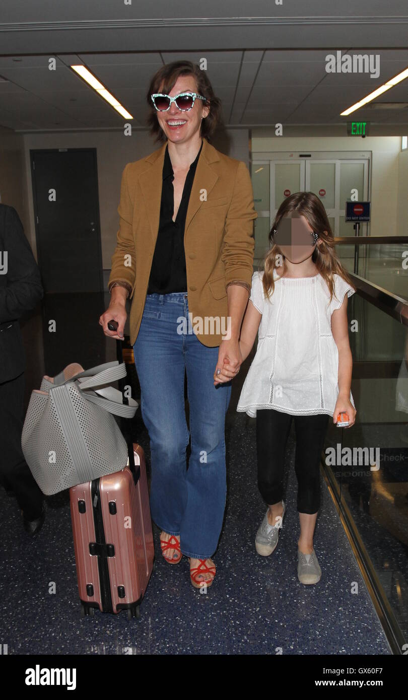 Milla Jovovich and her daughter Ever Gabo Anderson wearing sunglasses ...
