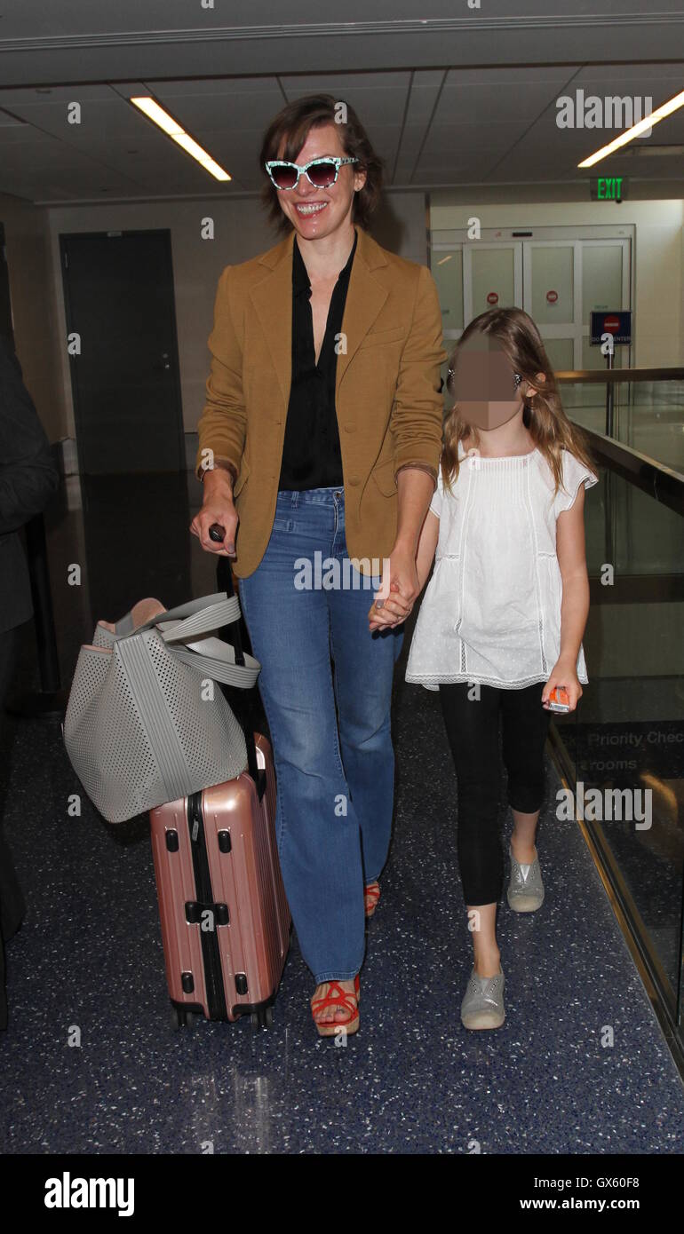 Milla Jovovich and her daughter Ever Gabo Anderson wearing sunglasses ...