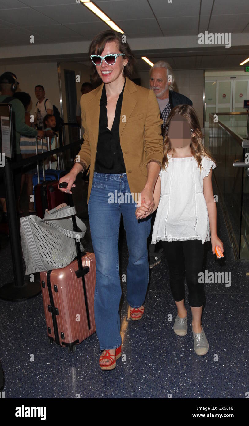 Milla Jovovich and her daughter Ever Gabo Anderson wearing sunglasses ...
