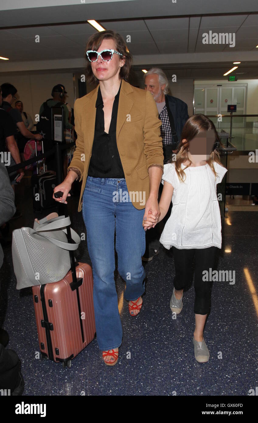Milla Jovovich and her daughter Ever Gabo Anderson wearing sunglasses ...