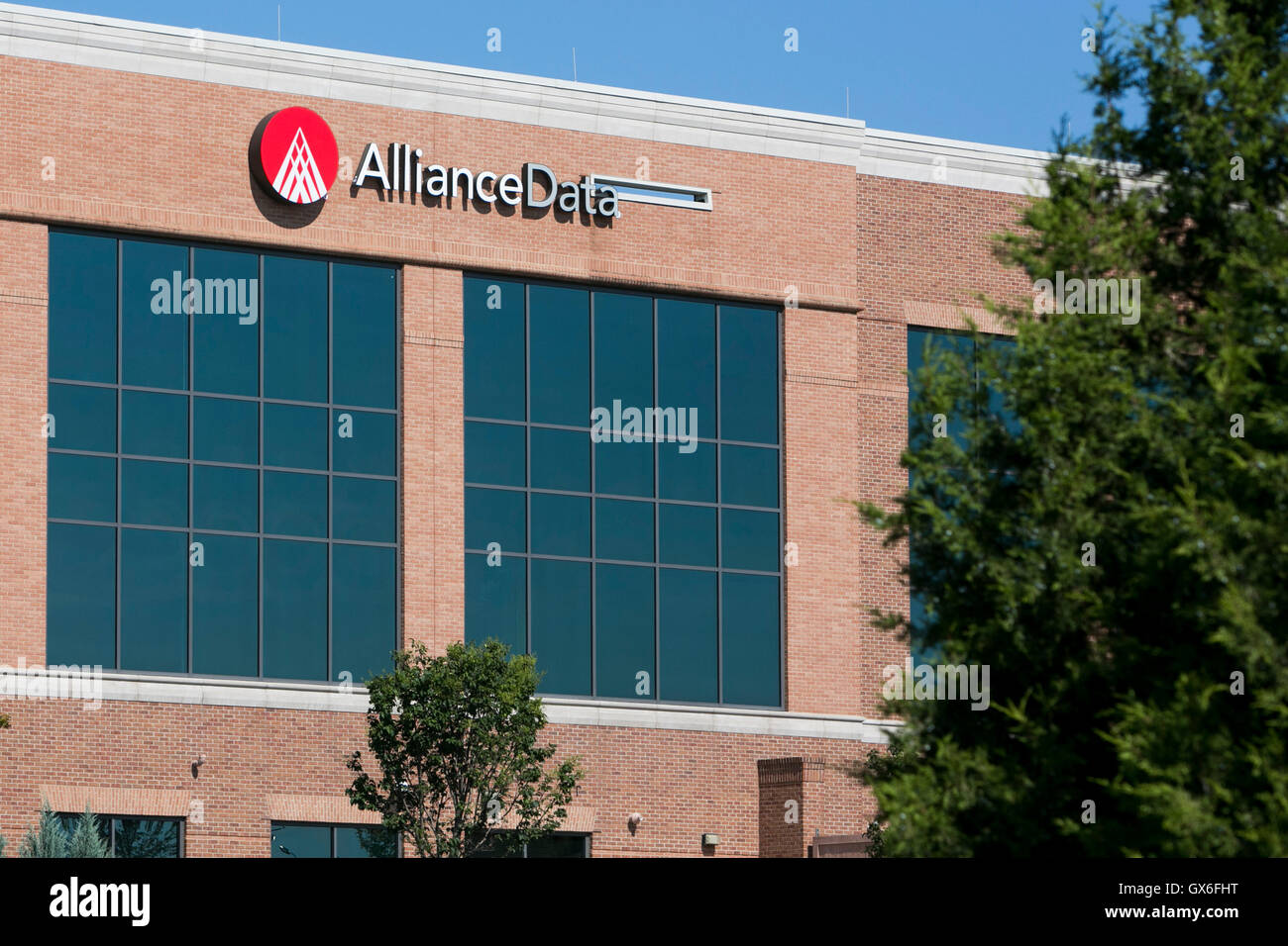 A logo sign outside of a facility occupied by the Alliance Data Systems ...