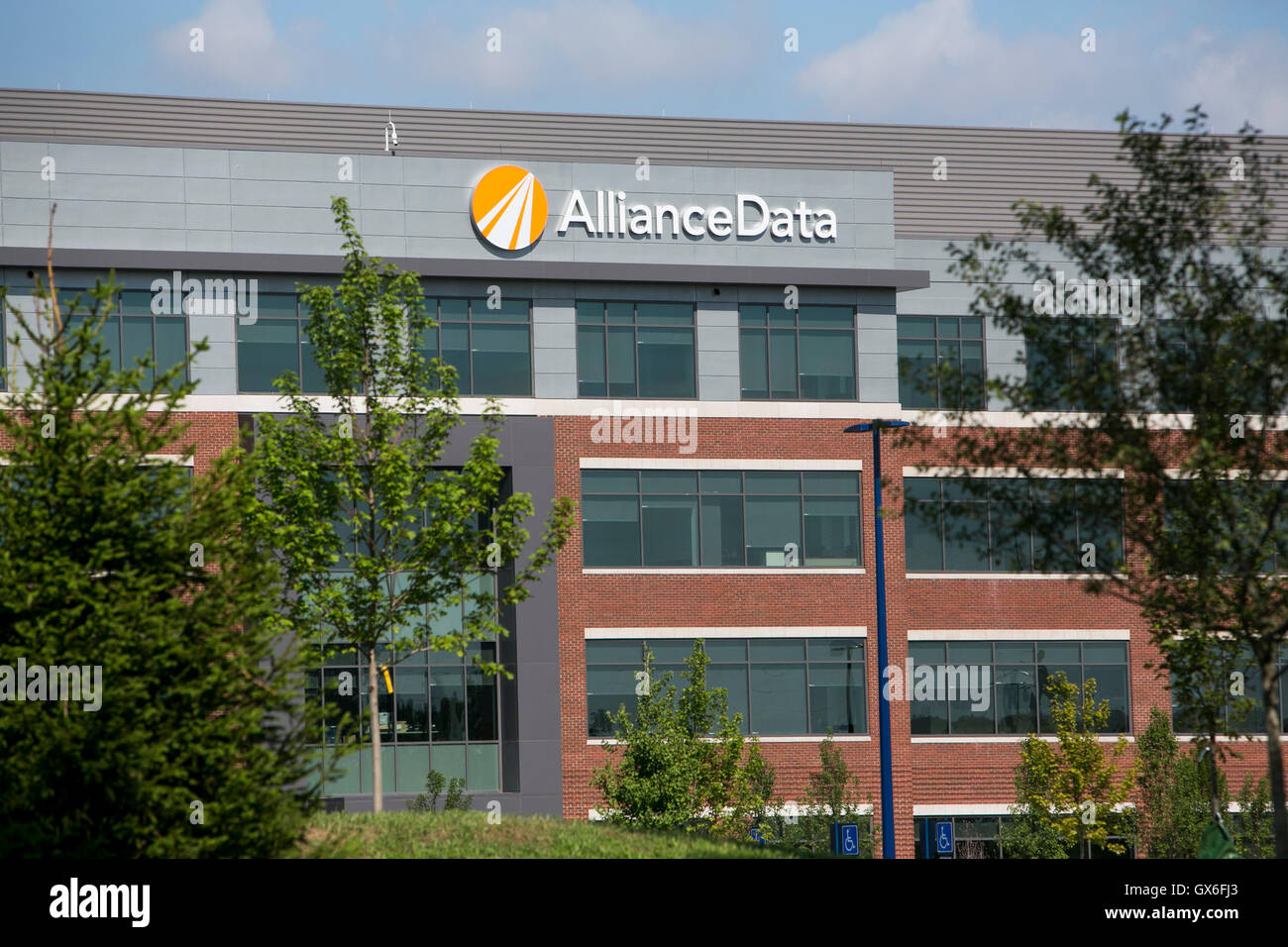 A logo sign outside of a facility occupied by the Alliance Data Systems ...