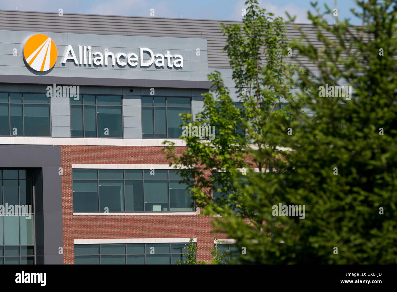 A logo sign outside of a facility occupied by the Alliance Data Systems ...