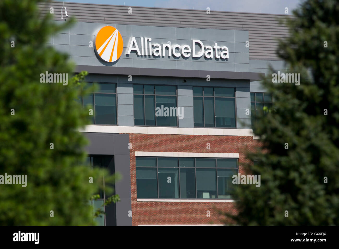 A logo sign outside of a facility occupied by the Alliance Data Systems ...
