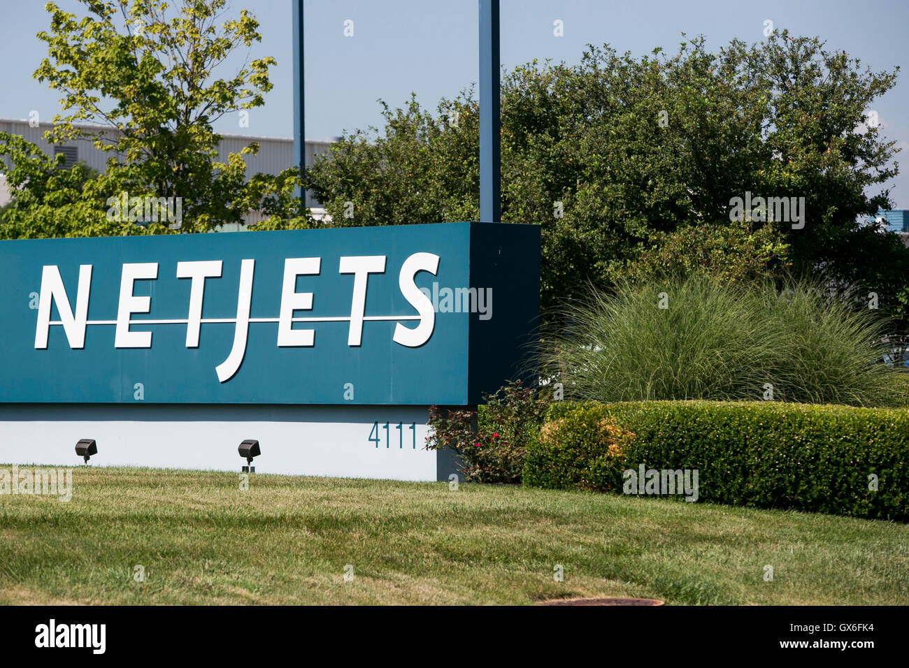 A logo sign outside of a facility occupied by NetJets Inc., in Columbus ...