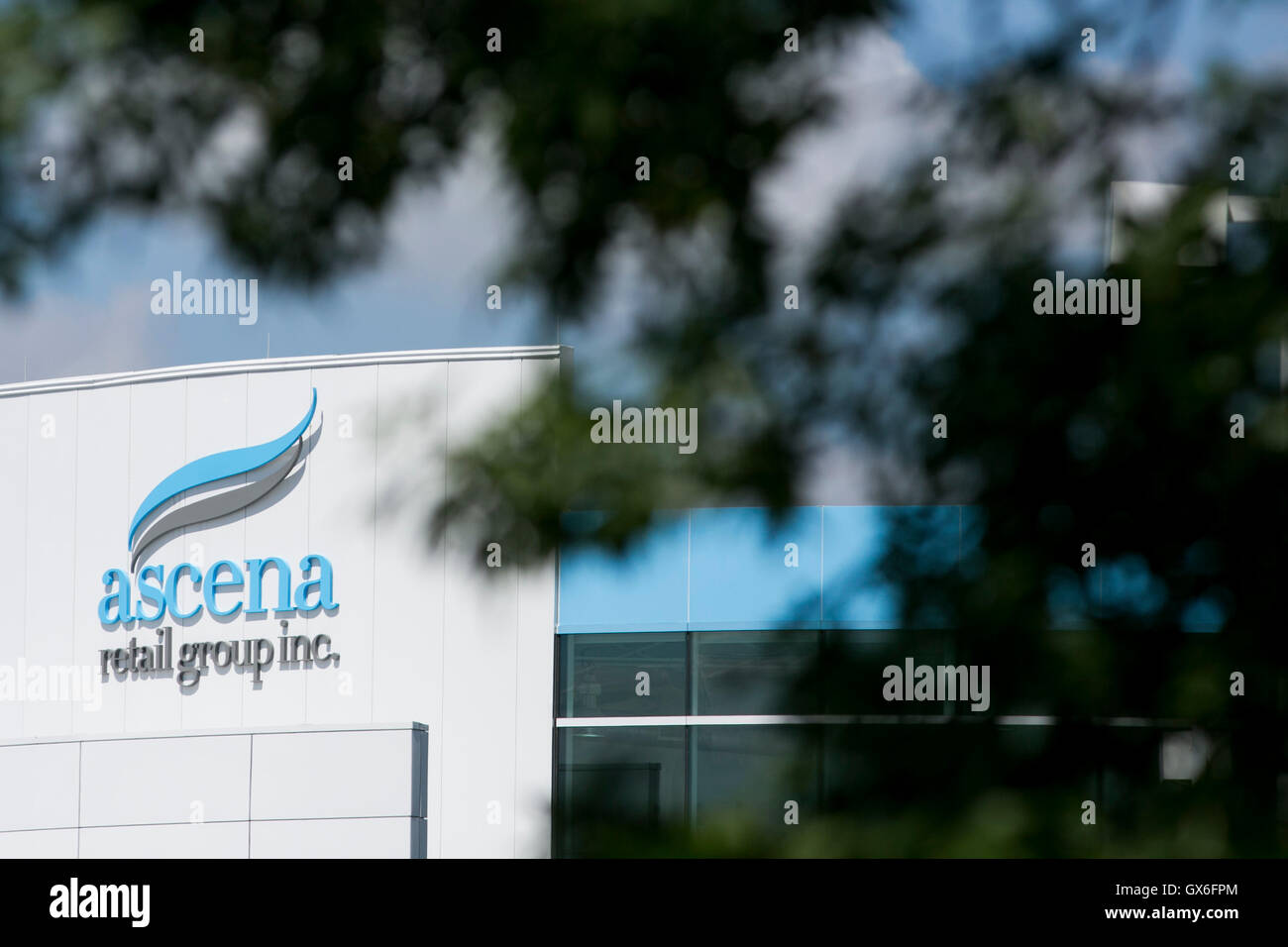 A logo sign outside of a facility occupied by Ascena Retail Group, Inc ...