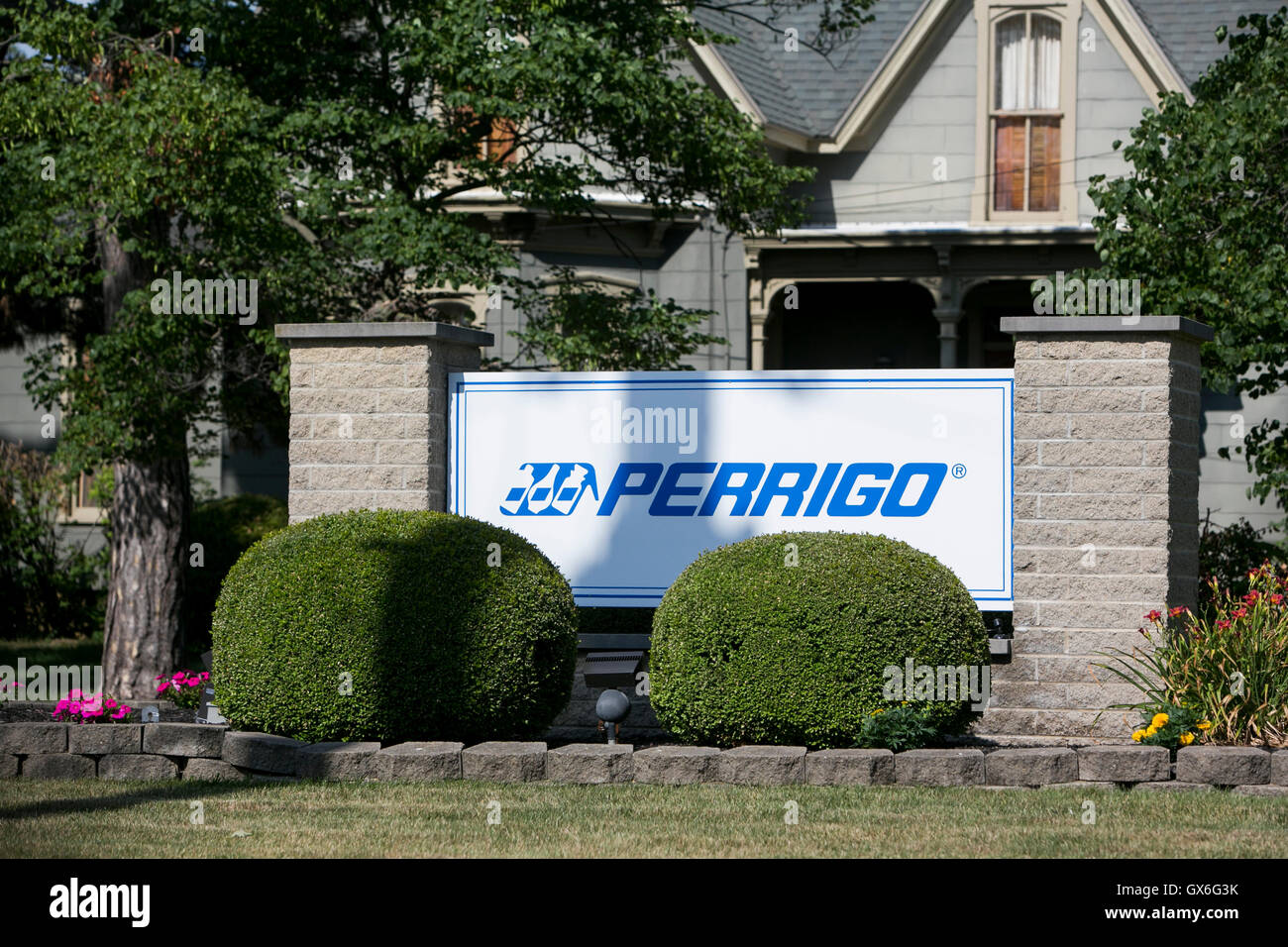 A logo sign outside of a facility occupied by the Perrigo Company in ...
