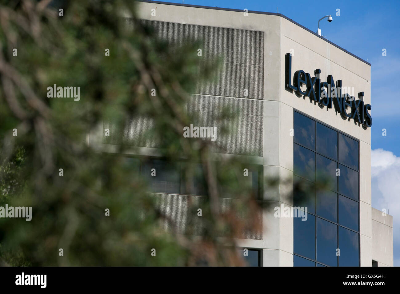 A logo sign outside of a facility occupied by the LexisNexis Group in ...