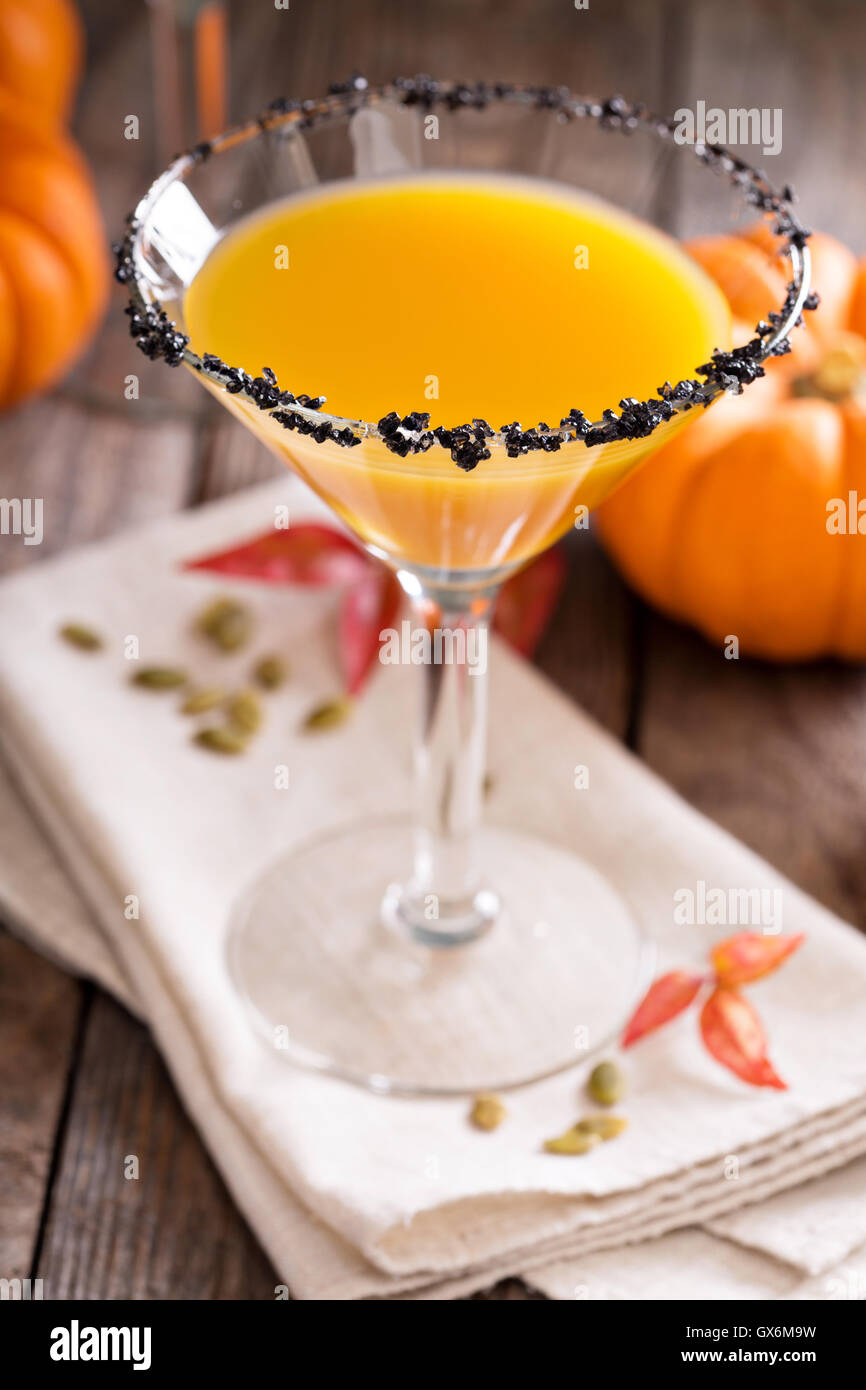 Pumpkin martini cocktail with black salt rim Stock Photo - Alamy