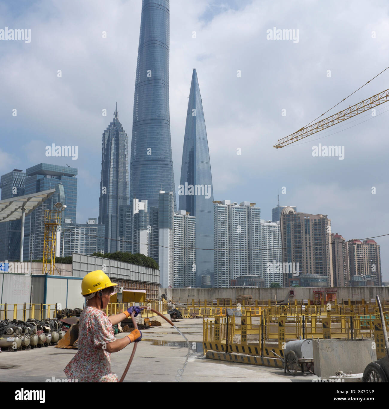 A female worker works in a construction site in Shanghai, China. 12-Sep ...