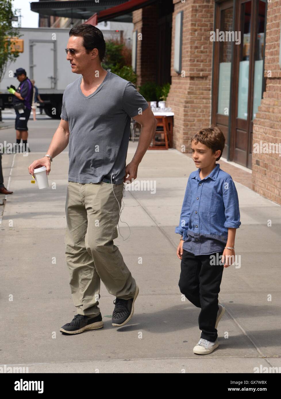 Matthew McConaughey leaves the hotel with his son Levi Alves ...