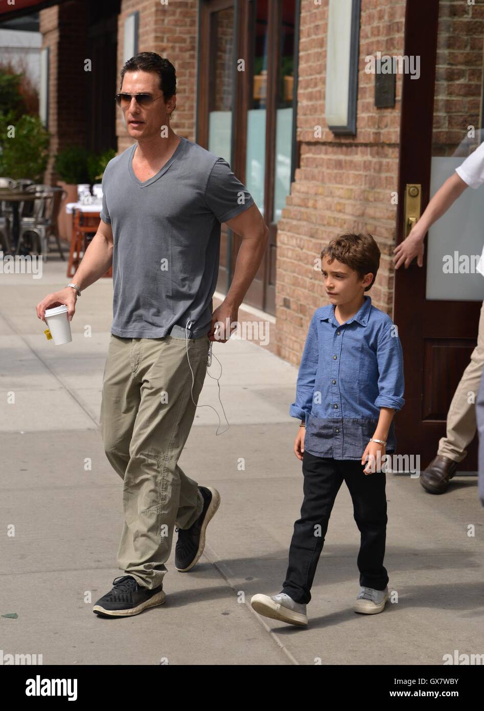 Matthew McConaughey leaves the hotel with his son Levi Alves ...