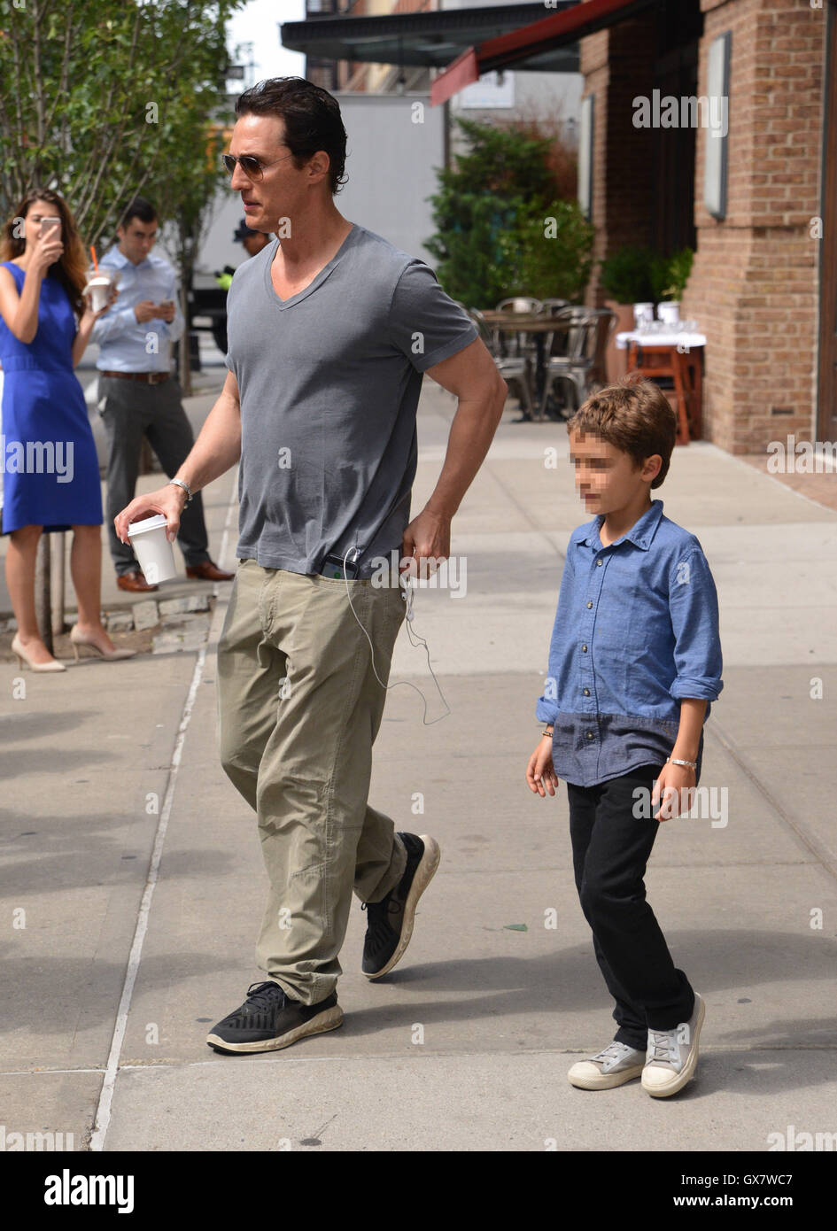 Matthew McConaughey leaves the hotel with his son Levi Alves ...