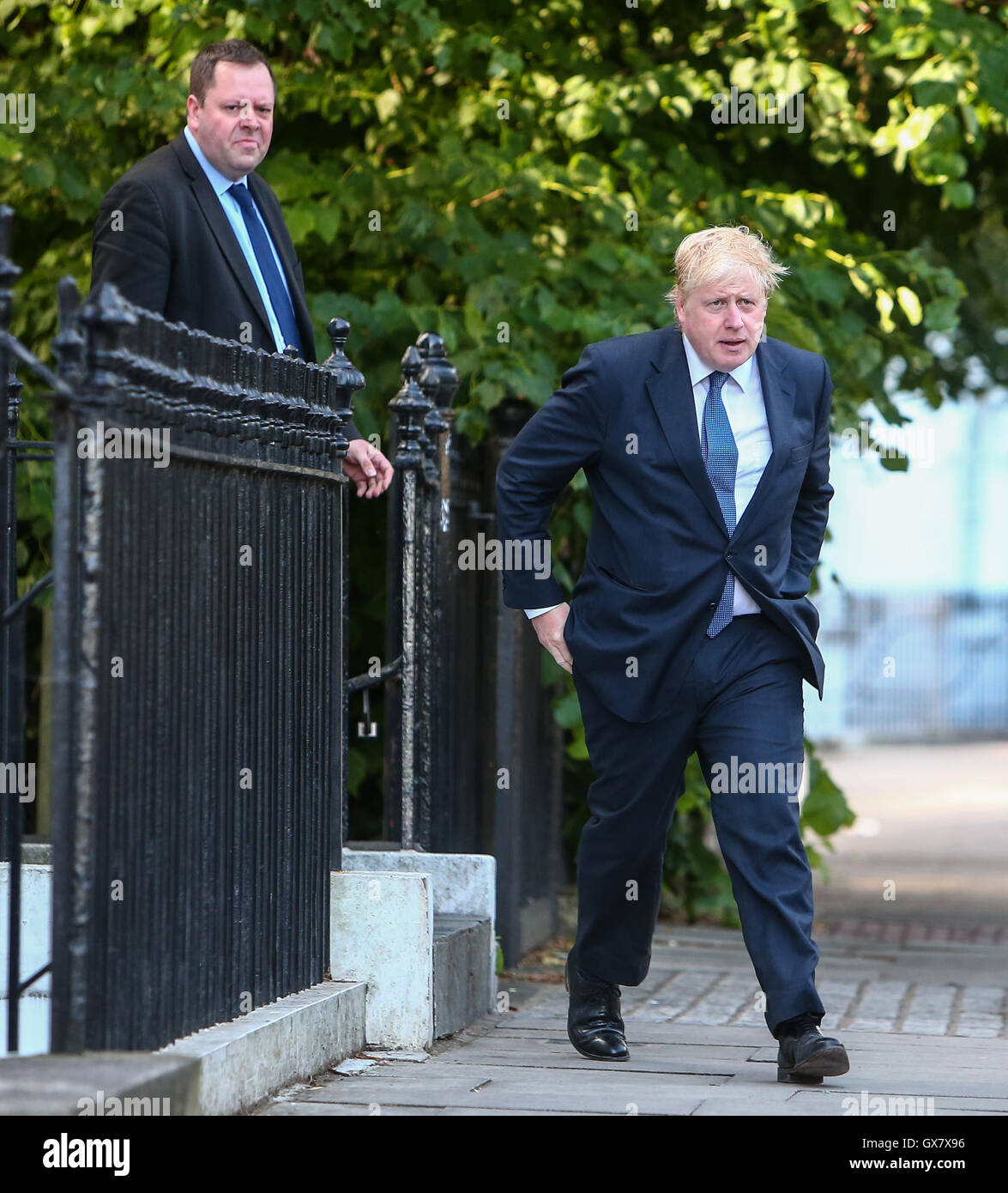 Boris Johnson MP leaves his north London home with a member of his team ...